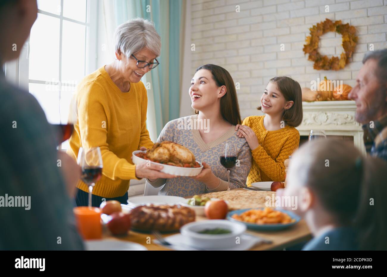 Happy Thanksgiving Day! Autumn feast. Family sitting at the table and ...