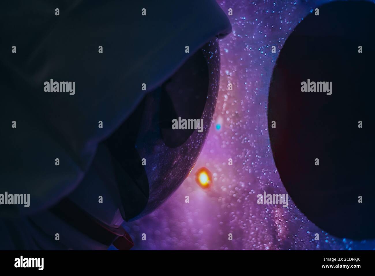 Astronaut looking deep space, galaxy and planets from the window of his ...