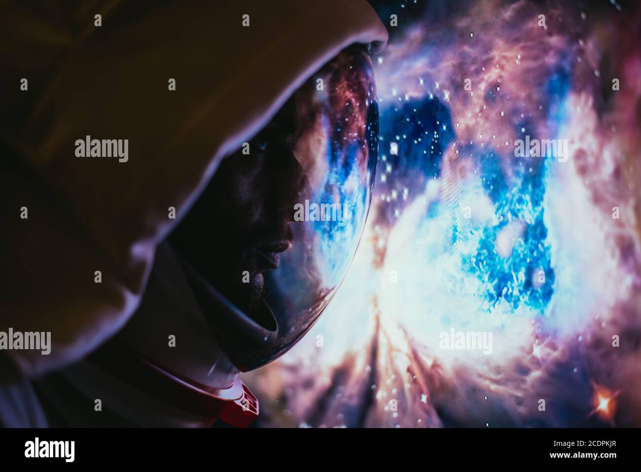 Astronaut looking deep space, galaxy and planets from the window of his ...