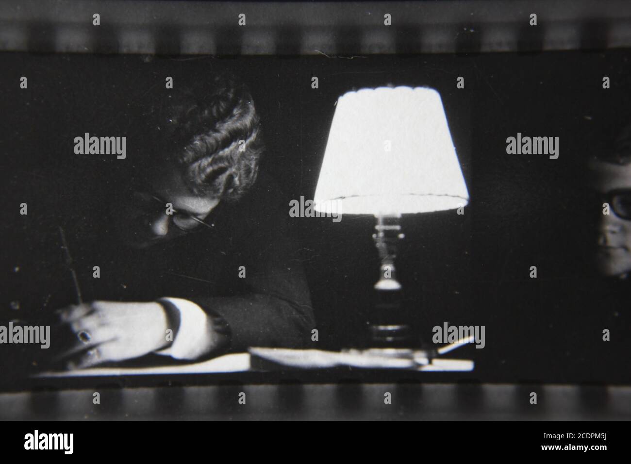 Fine 1970s vintage black and white photography of a young man writing a ...