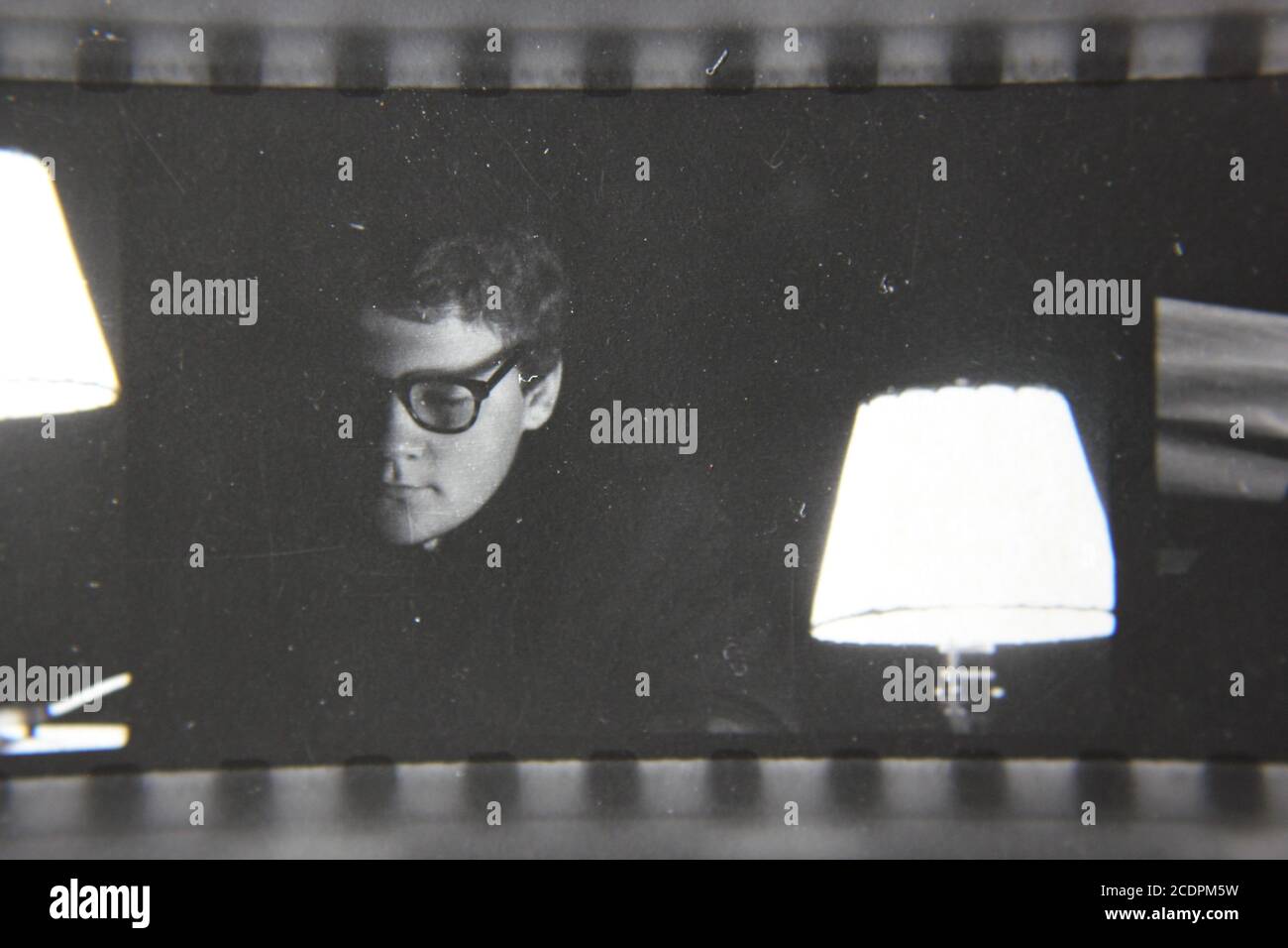 Fine 1970s vintage black and white photography of a young man writing a ...