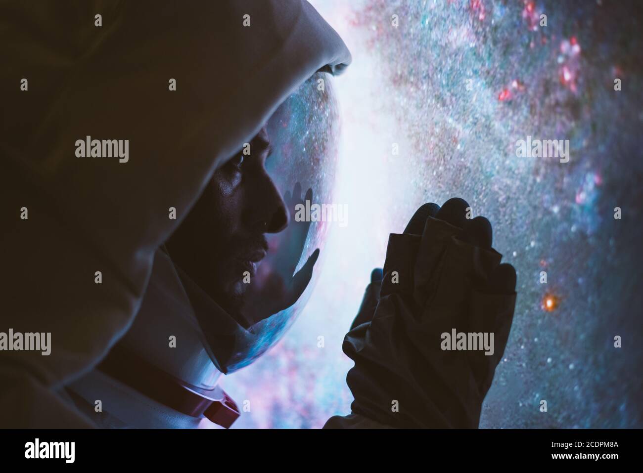 Astronaut looking deep space, galaxy and planets from the window of his ...