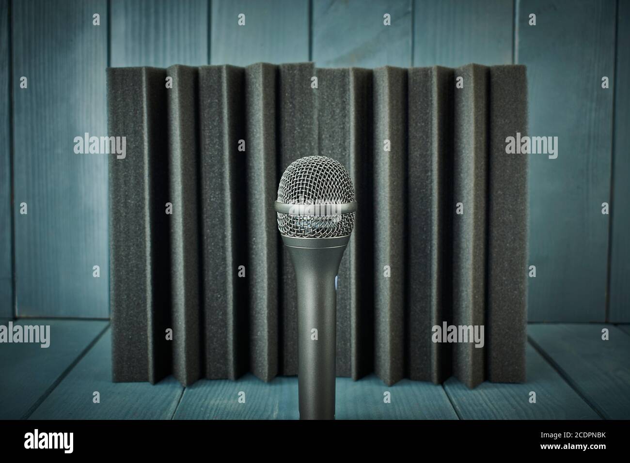 Vocal and chorus microphone with grille and capsule in the foreground ...