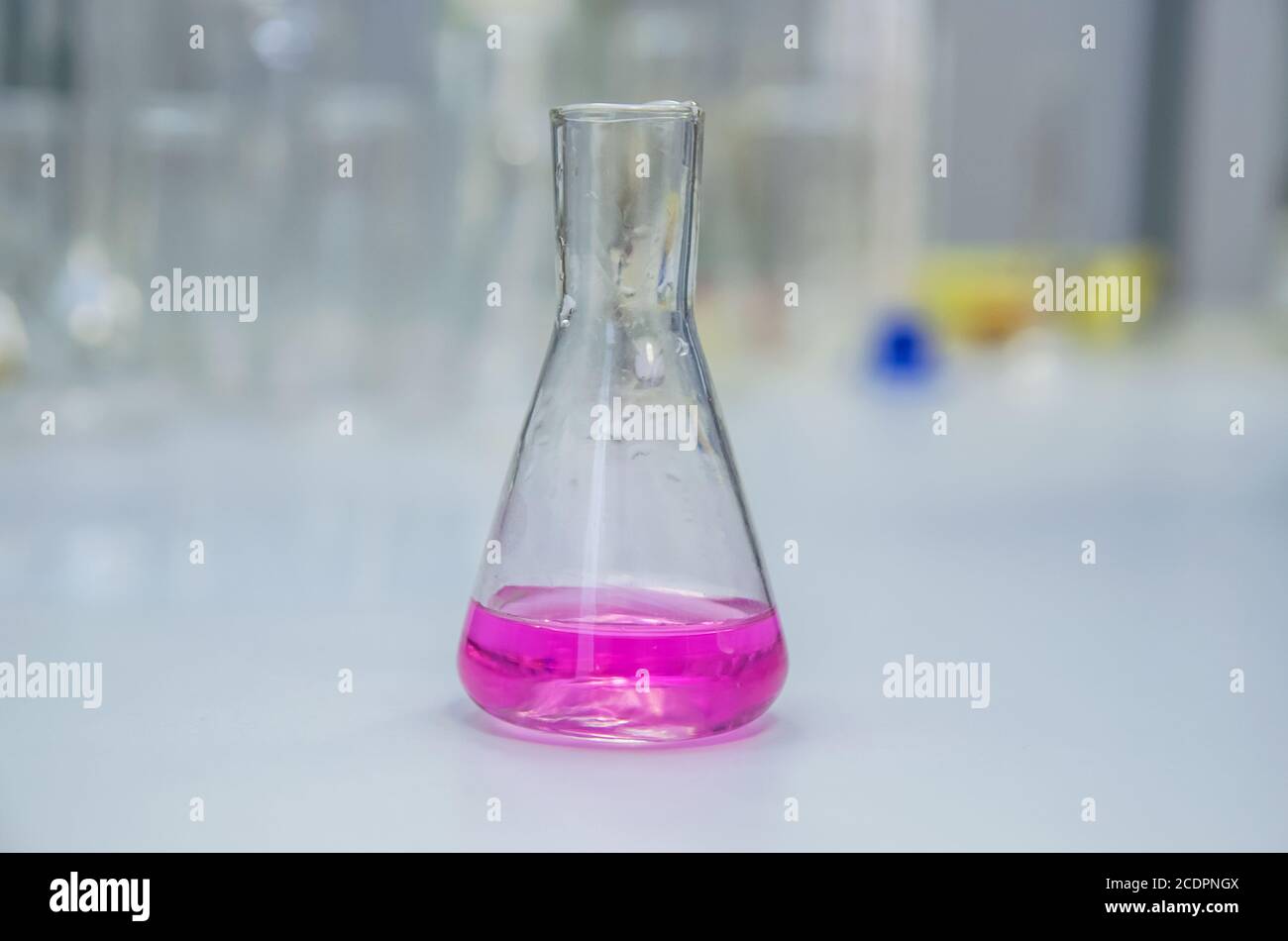 Laboratory glassware with liquid on table. Chemical analysis Stock ...