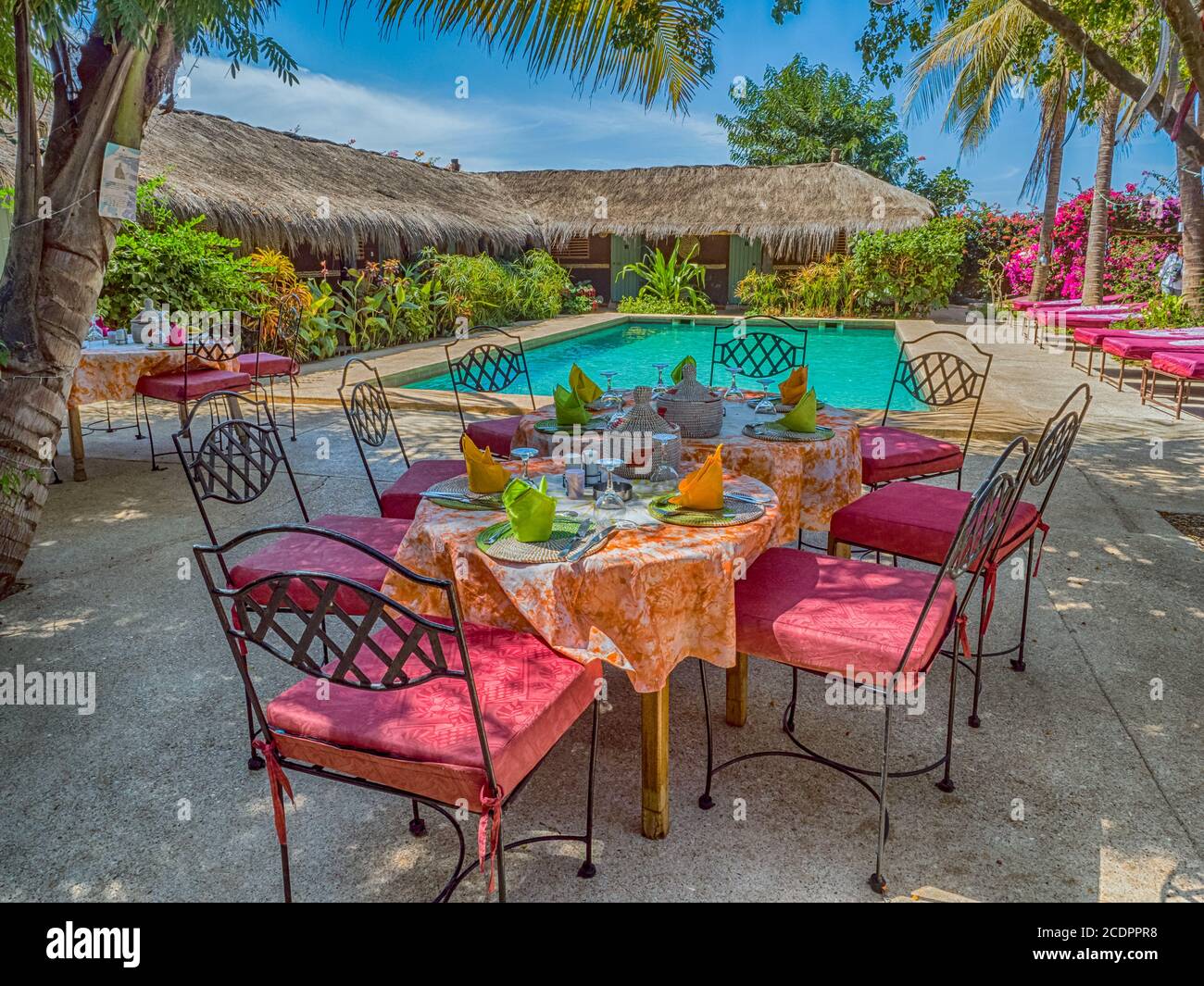 Senegal, Africa - January 2019: A covered table awaits guests next to ...