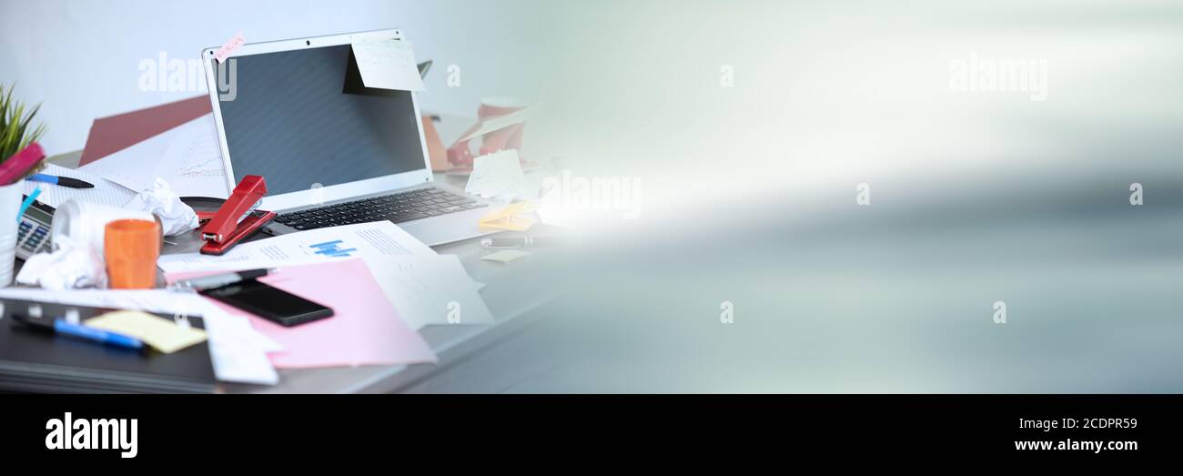 Messy and cluttered office desk; panoramic banner Stock Photo - Alamy
