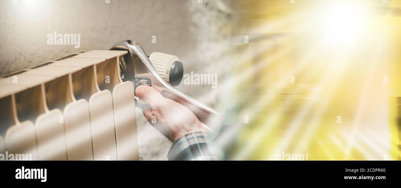 Repairman working on radiator with wrench; multiple exposure Stock ...