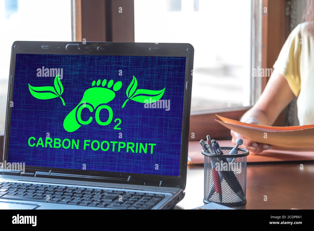 Laptop screen displaying a carbon footprint concept Stock Photo - Alamy