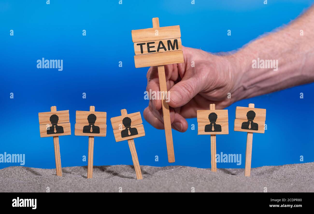 Concept of teamwork with icons on wooden signs Stock Photo - Alamy