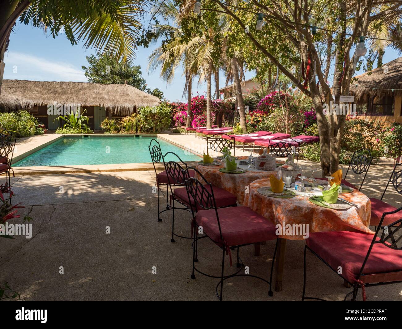 Senegal, Africa - January 2019: A covered table awaits guests next to ...