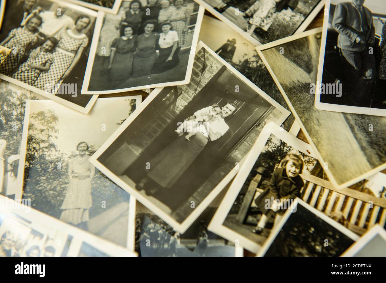 Old family sepia photos flay played on table from the 20s,30,s40s ...