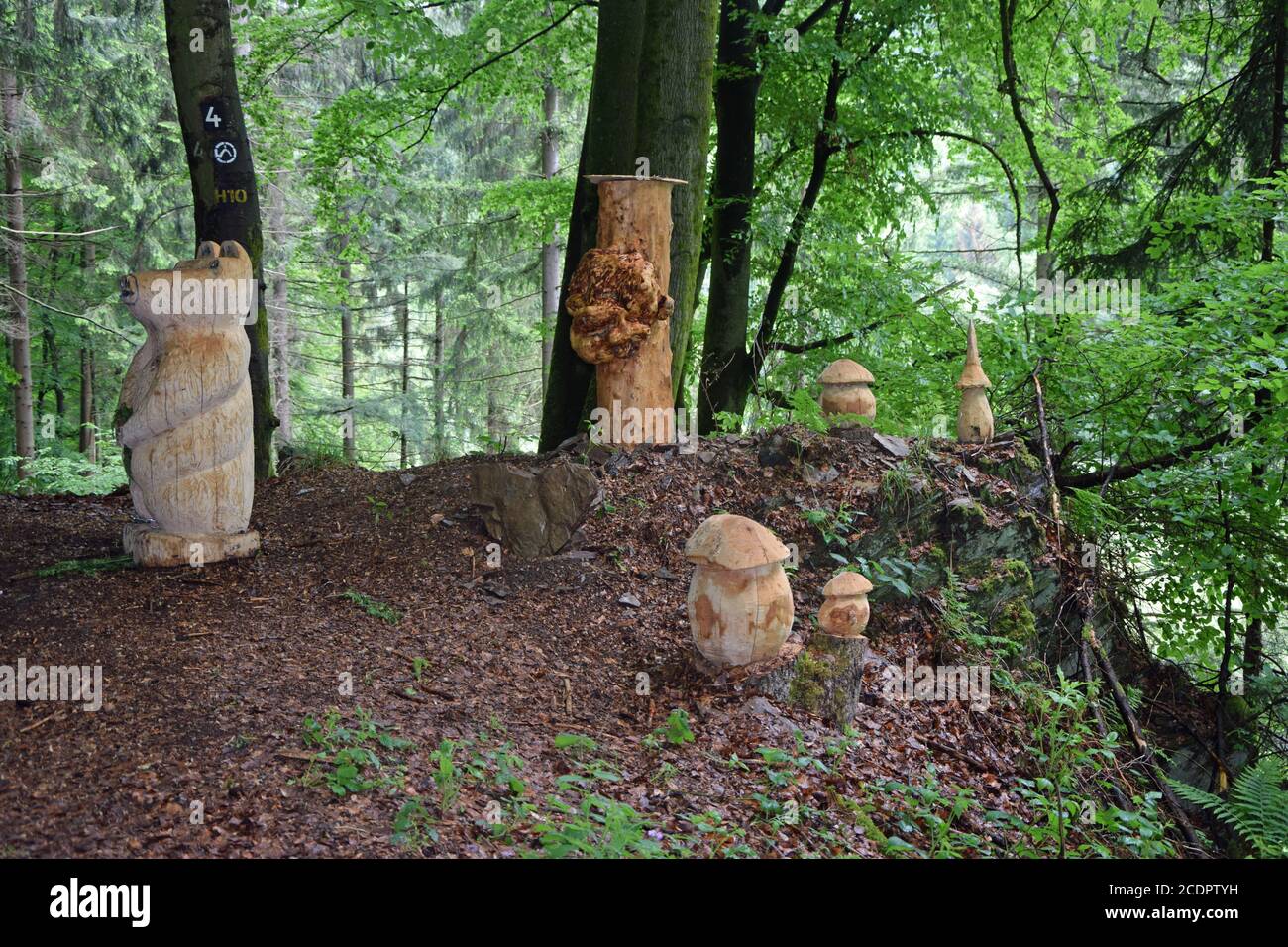 Wooden figures in the forest Stock Photo - Alamy