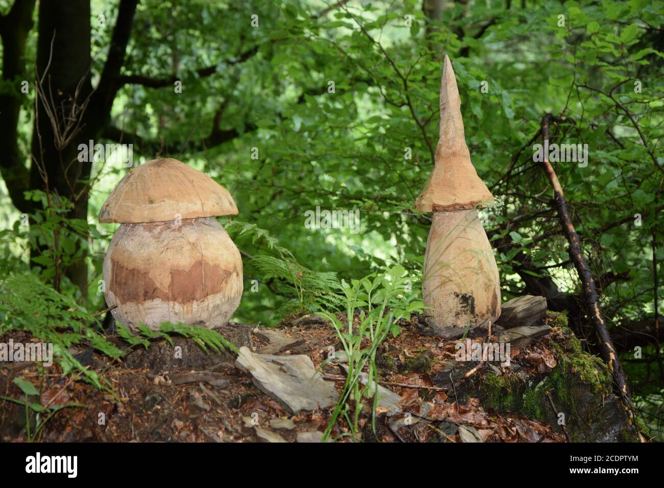 Wooden figures in the forest Stock Photo - Alamy
