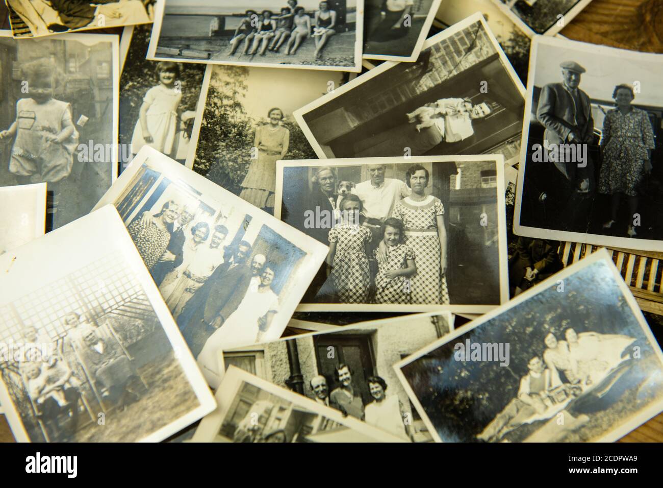 Old family sepia photos flay played on table from the 20s,30,s40s ...