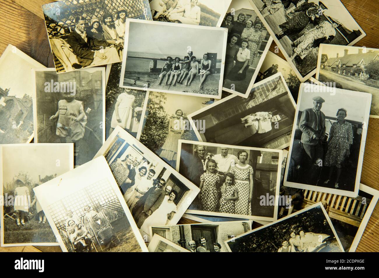 Old family sepia photos flay played on table from the 20s,30,s40s ...