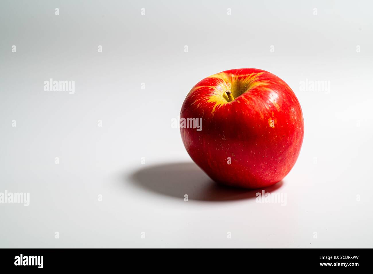 Apple isolated against a plain white background Stock Photo - Alamy