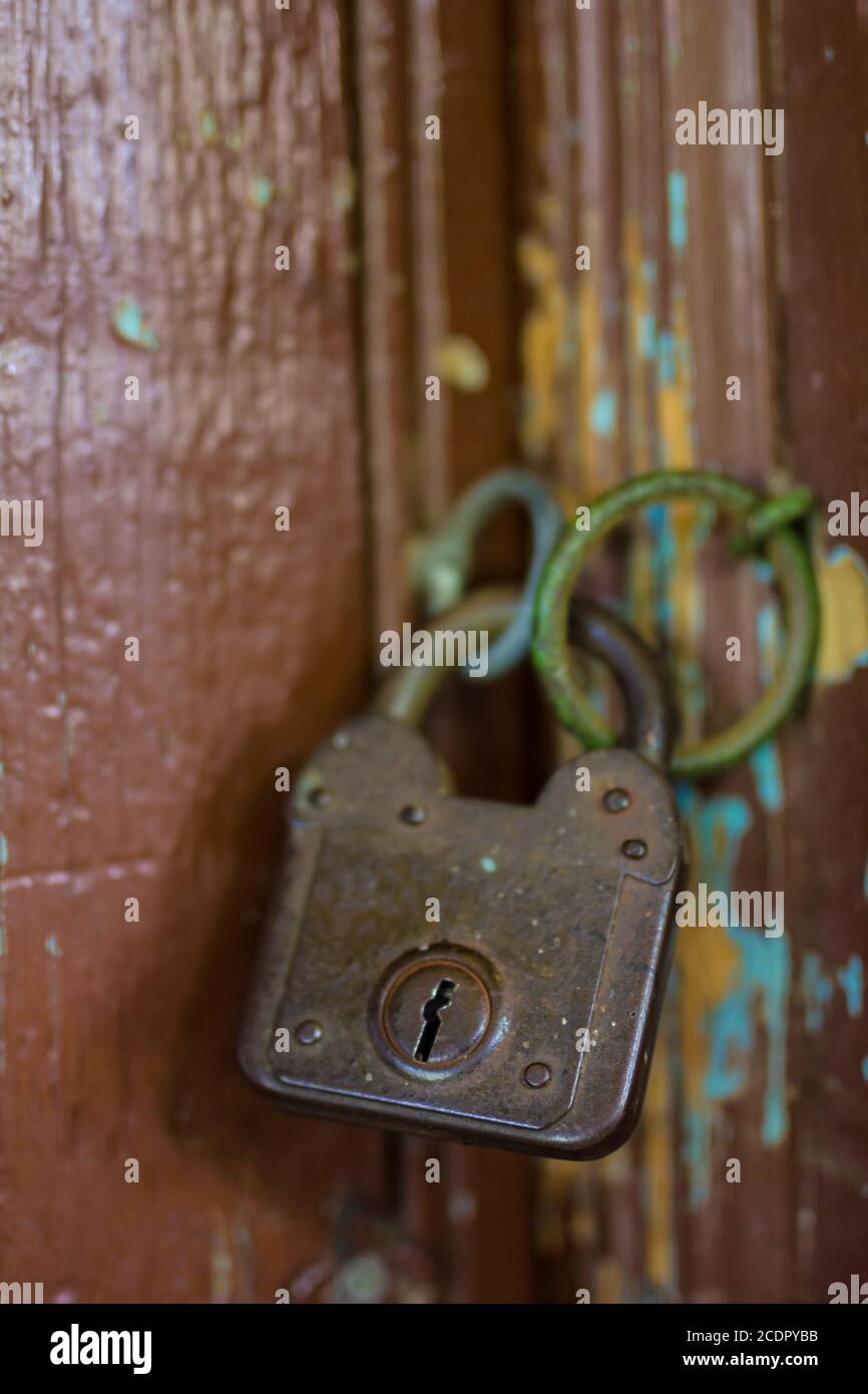 Old rusty lock on the wooden gate Stock Photo - Alamy