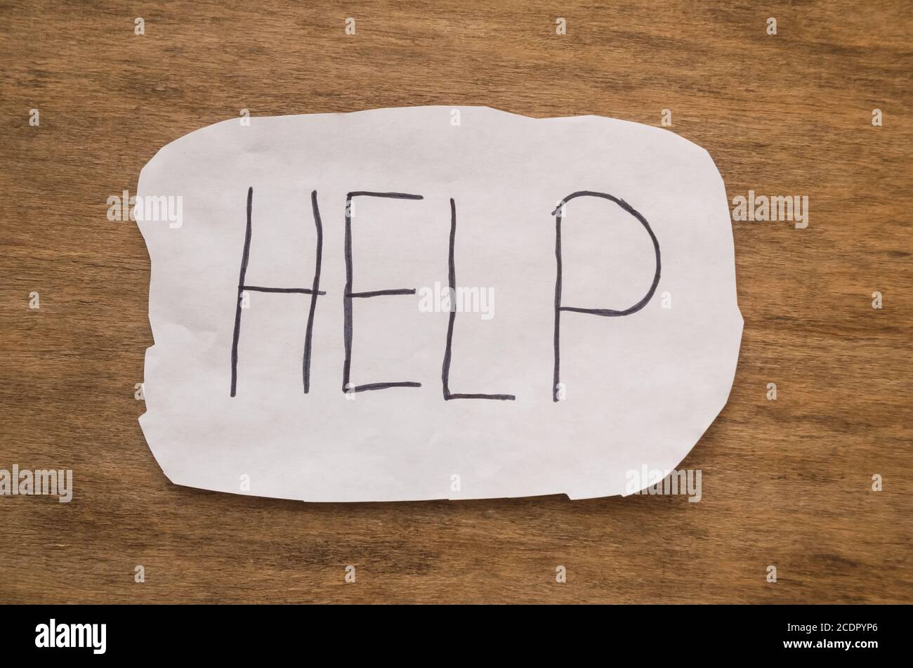 a sheet of paper on the floor labeled HELP Stock Photo - Alamy
