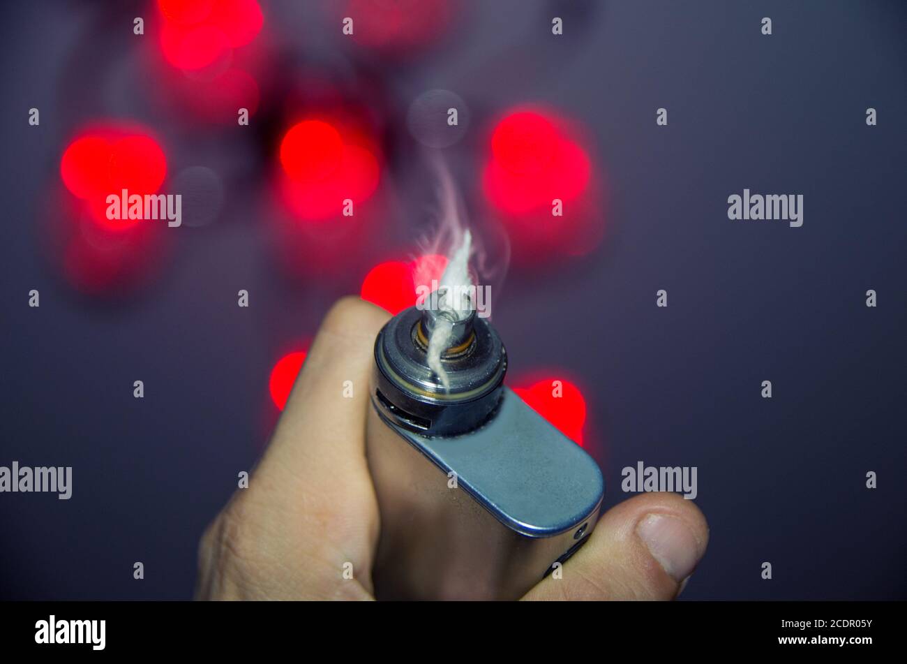 electronic cigarette, veape on a red background, smoke Stock Photo - Alamy