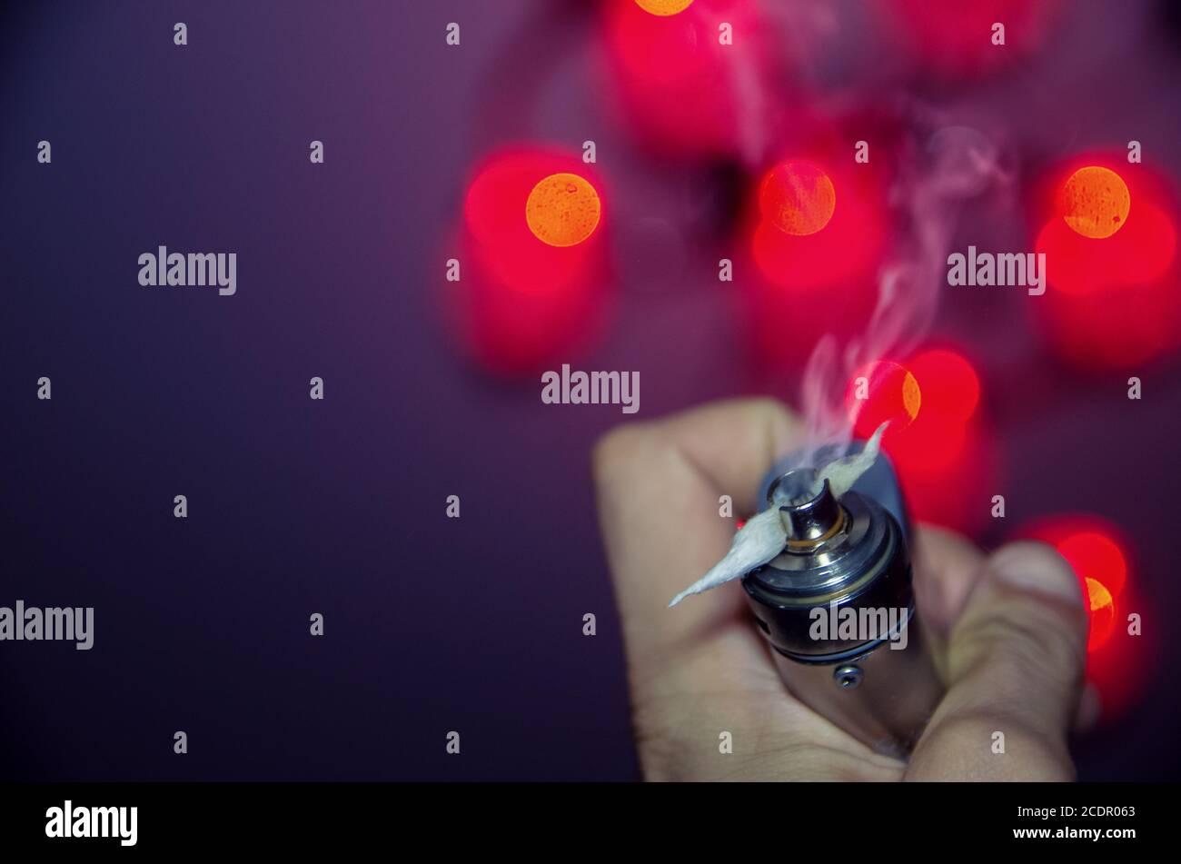 electronic cigarette, veape on a red background, smoke Stock Photo - Alamy