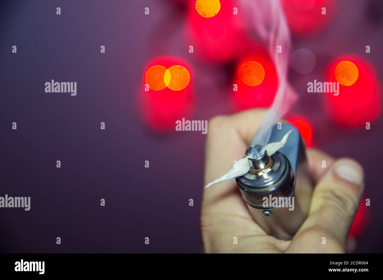 electronic cigarette, veape on a red background, smoke Stock Photo - Alamy