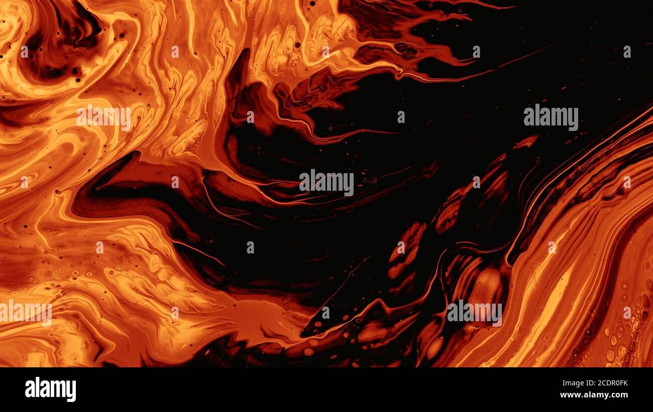 Abstract patterns. Fiery liquid on a black background Stock Photo - Alamy