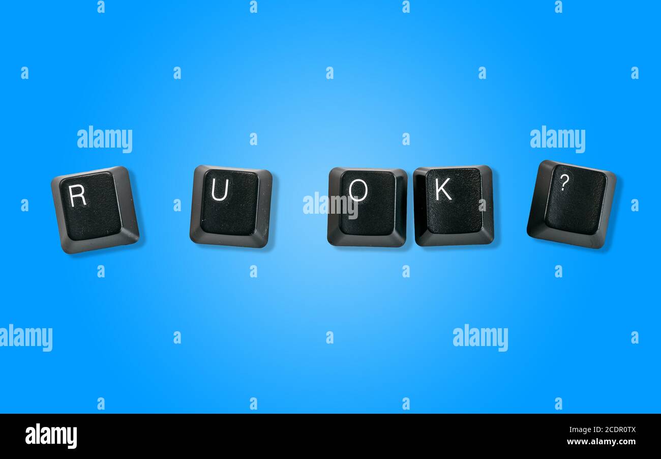Computer keyboard keys spelling R U OK?, isolated on a blue background Stock Photo - Alamy