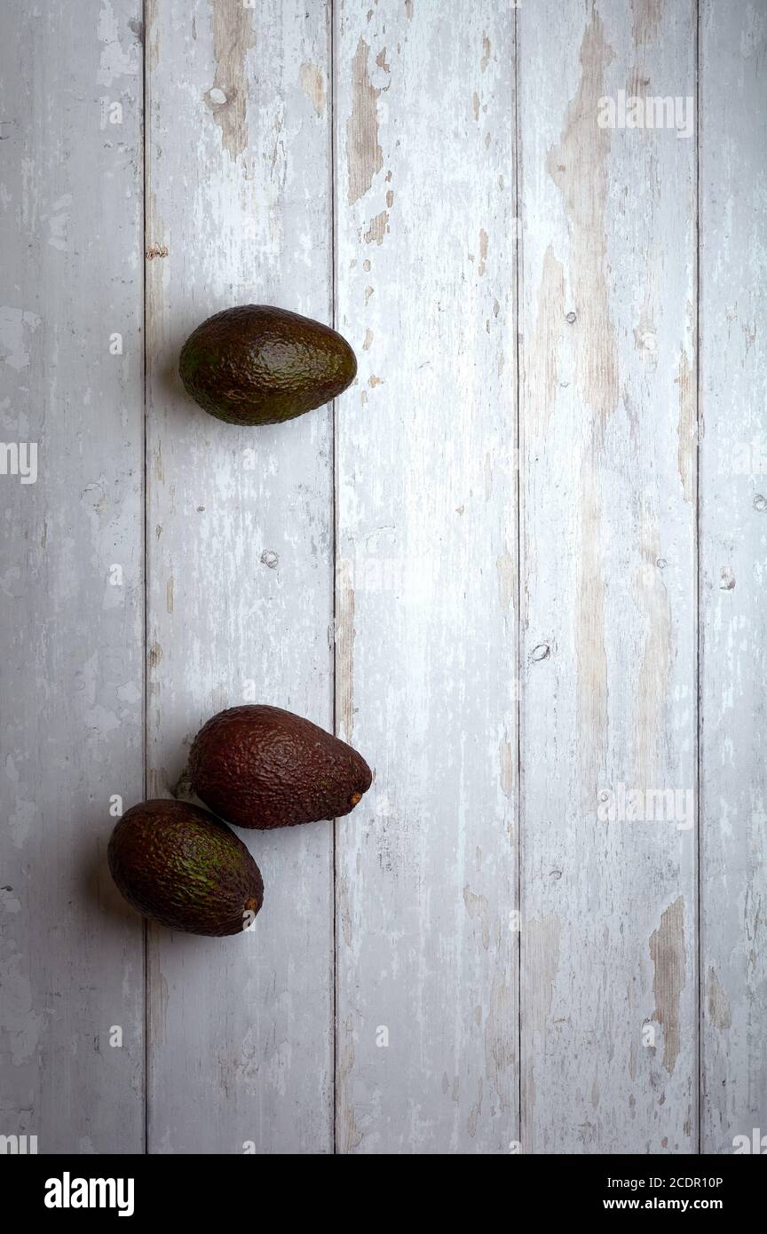 set of avocados, cut and uncut, on a clear background of deteriorated ...