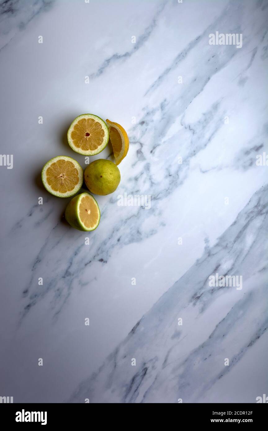 Lemons cut on marble hi-res stock photography and images - Alamy