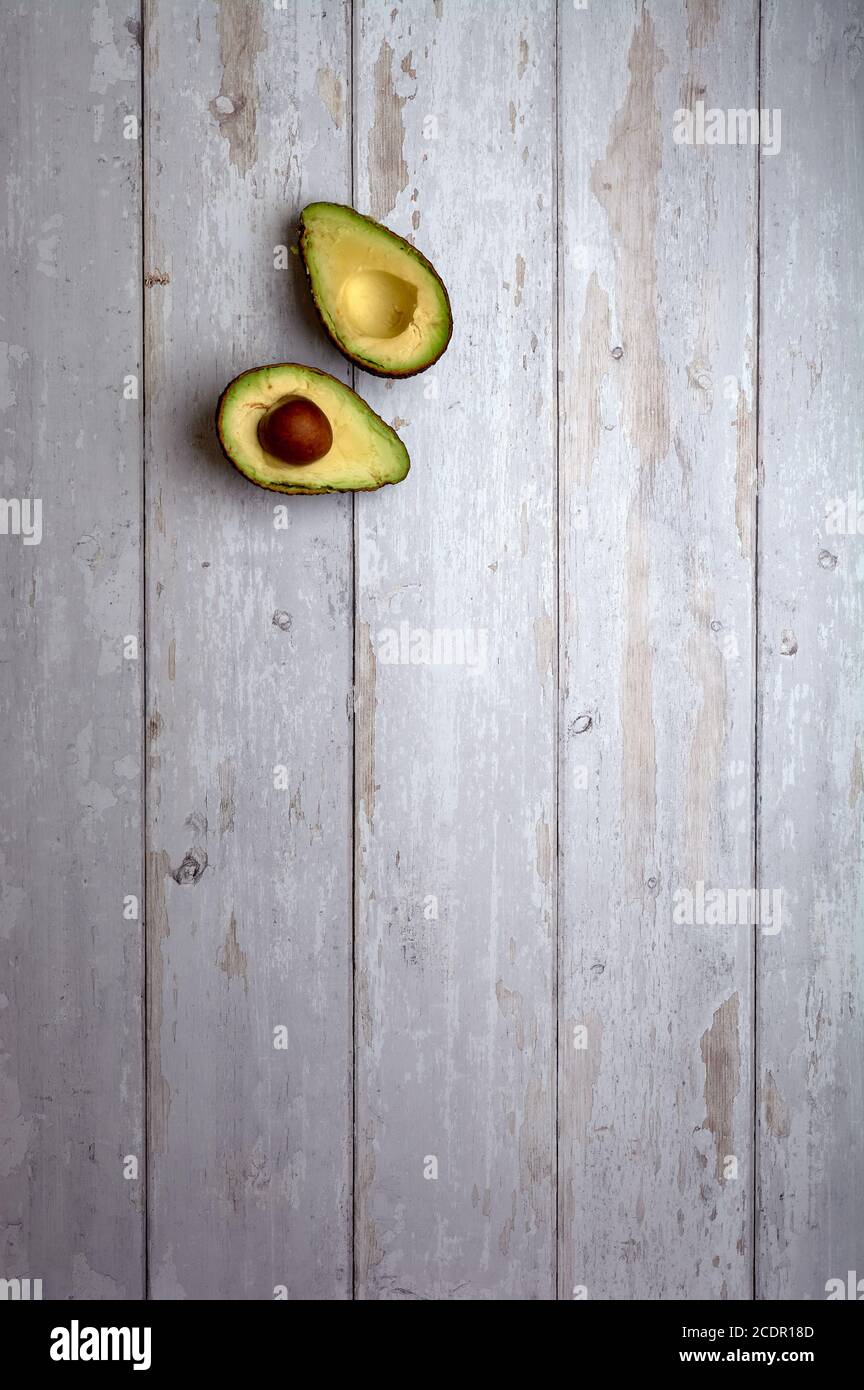 set of avocados, cut and uncut, on a clear background of deteriorated ...