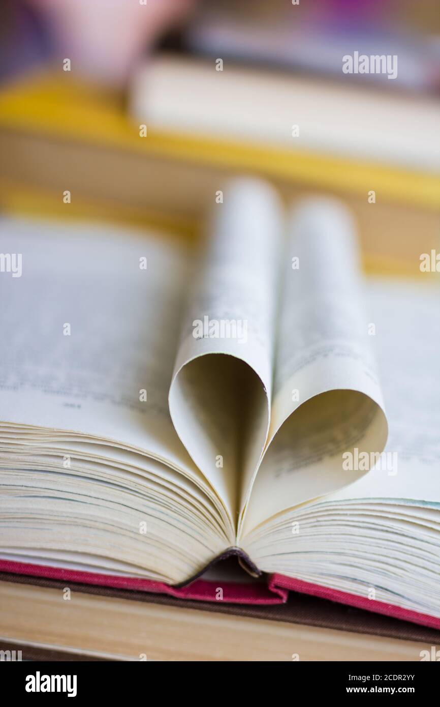 Opened book with heart shaped pages Stock Photo - Alamy