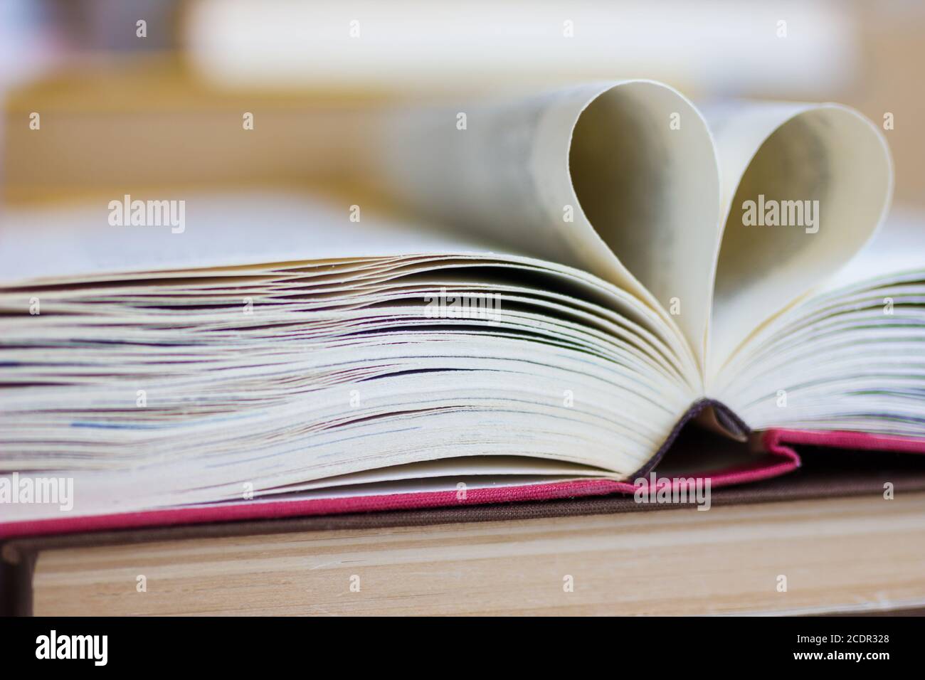 Opened book with heart shaped pages Stock Photo - Alamy