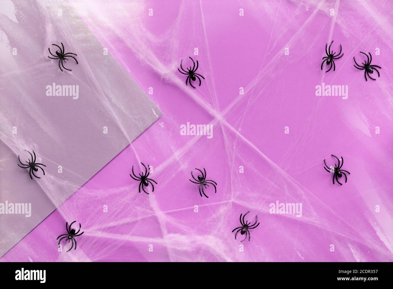 Geometric Halloween background with spider web and black spiders on ...
