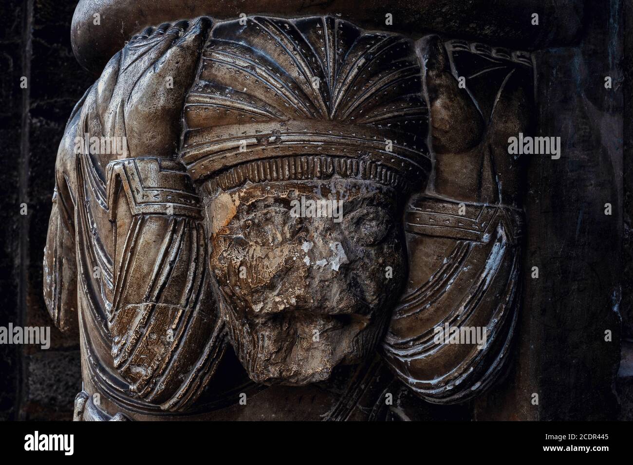 Face of tired and weary man. Medieval Romanesque stone telamon helps to ...