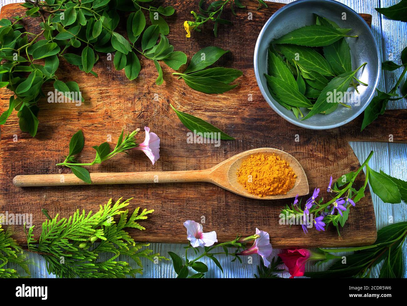 Turmeric on a spoon in the kitchen Stock Photo - Alamy