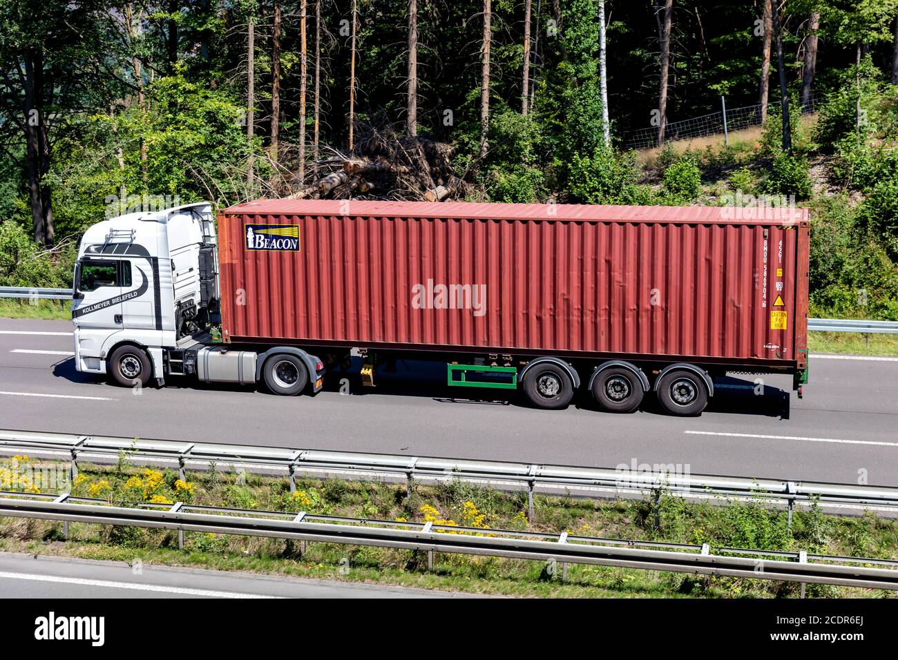 Kollmeyer MAN truck with Beacon container on motorway Stock Photo - Alamy