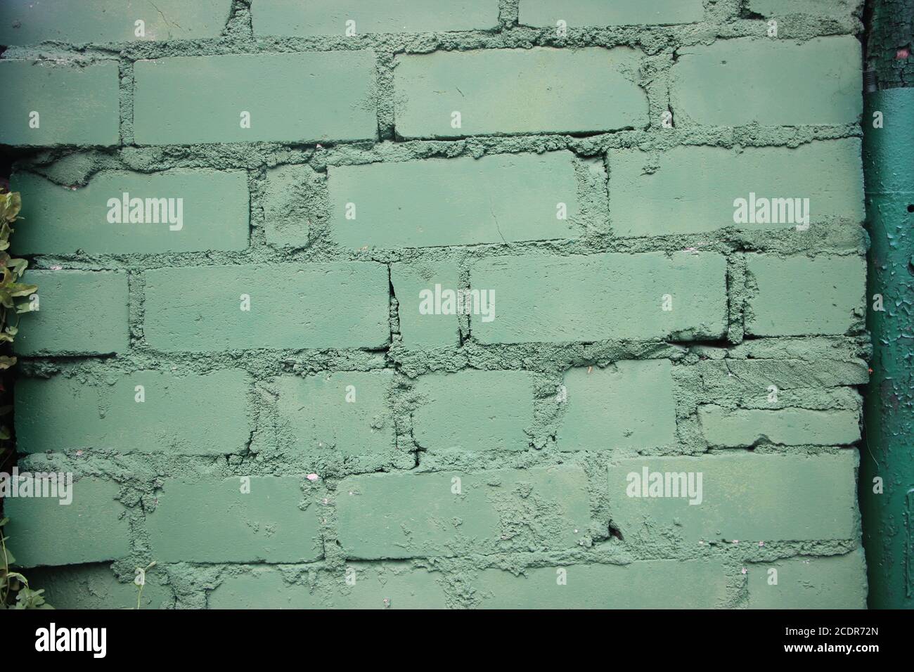 Painted into military green Brick wall background closeup Stock Photo ...