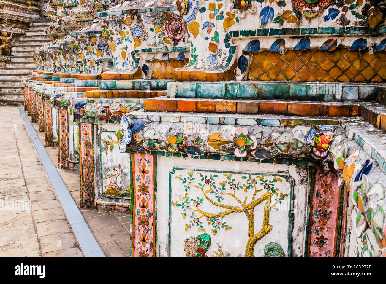 Detail of Wat Arun temple decorated with colorful tiles and floral ...