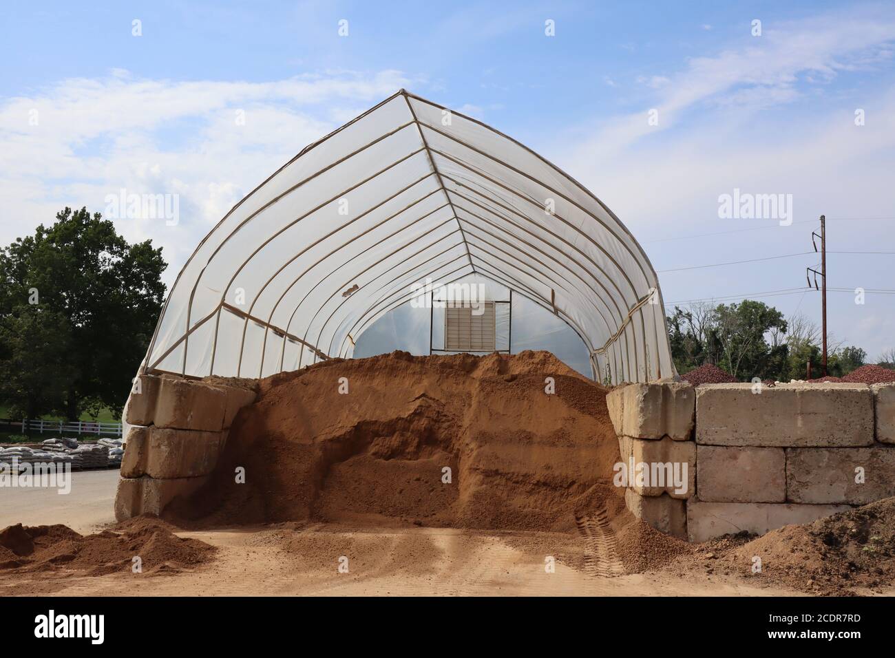 The mulch is stored in the outdoor storage facility Stock Photo - Alamy