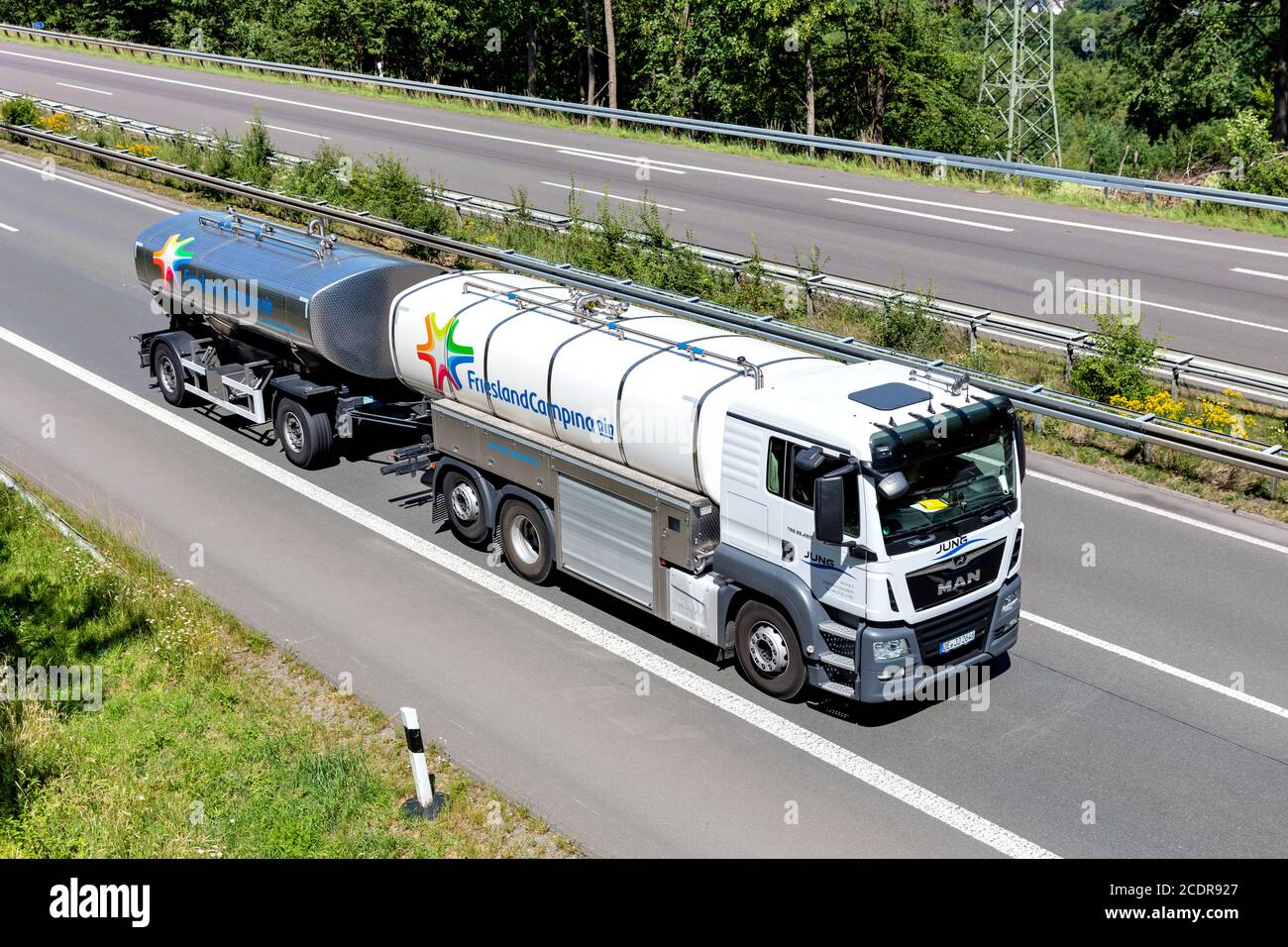 FrieslandCampina MAN TGS milk truck on German motorway Stock Photo - Alamy