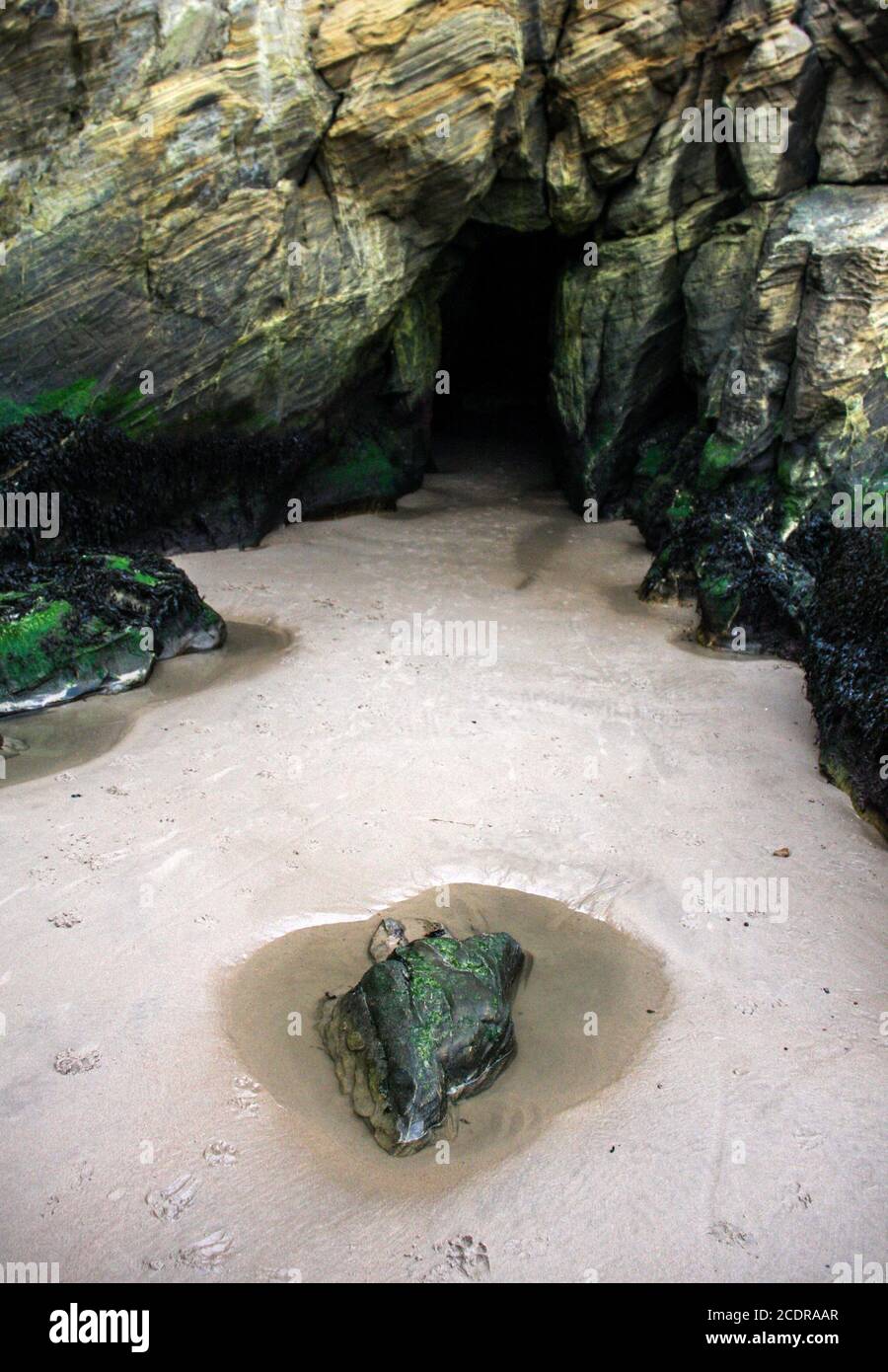 A Cave entrance on the beach Stock Photo - Alamy
