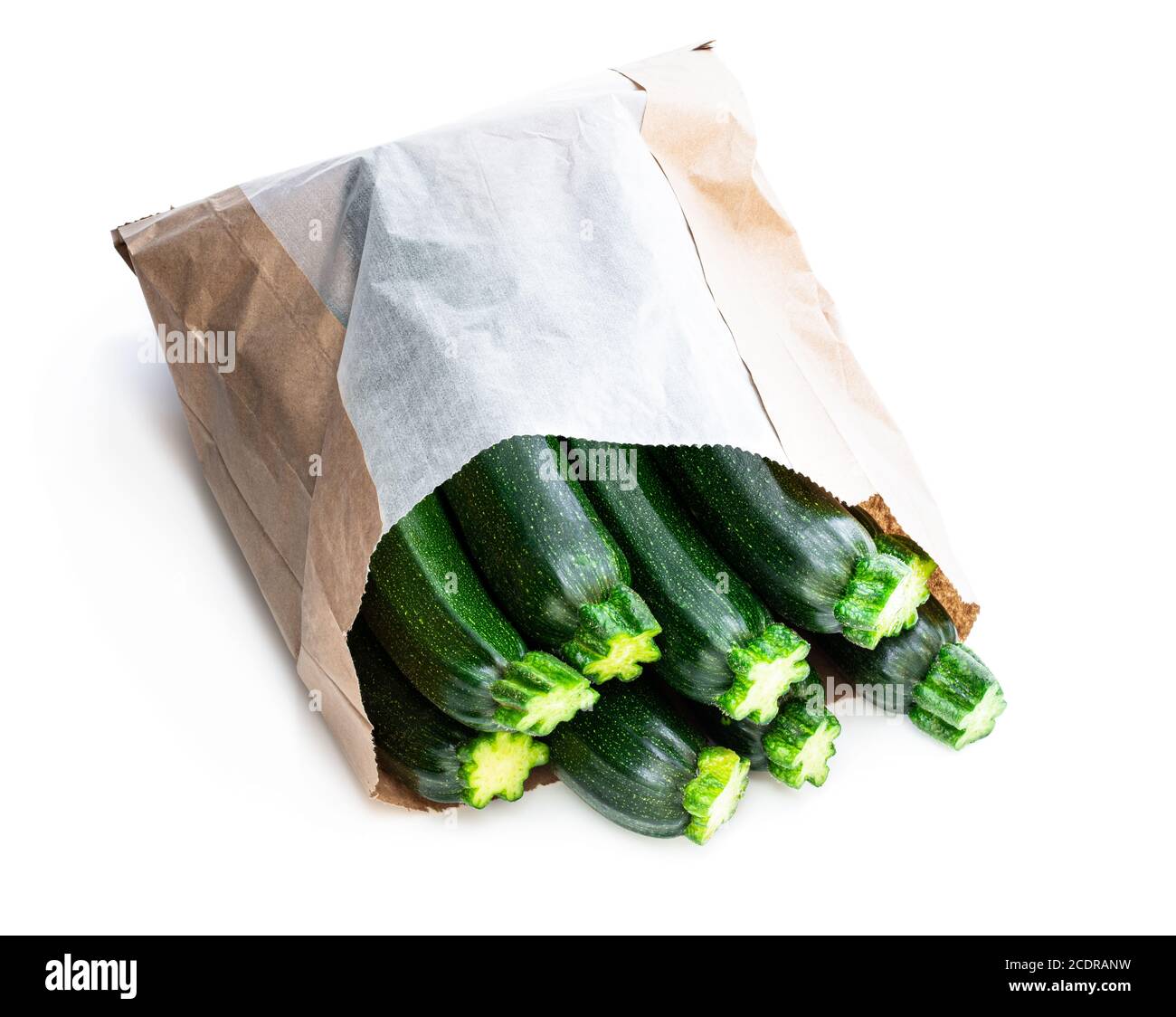 Fresh zucchini in paper bag isolated on white background Stock Photo ...