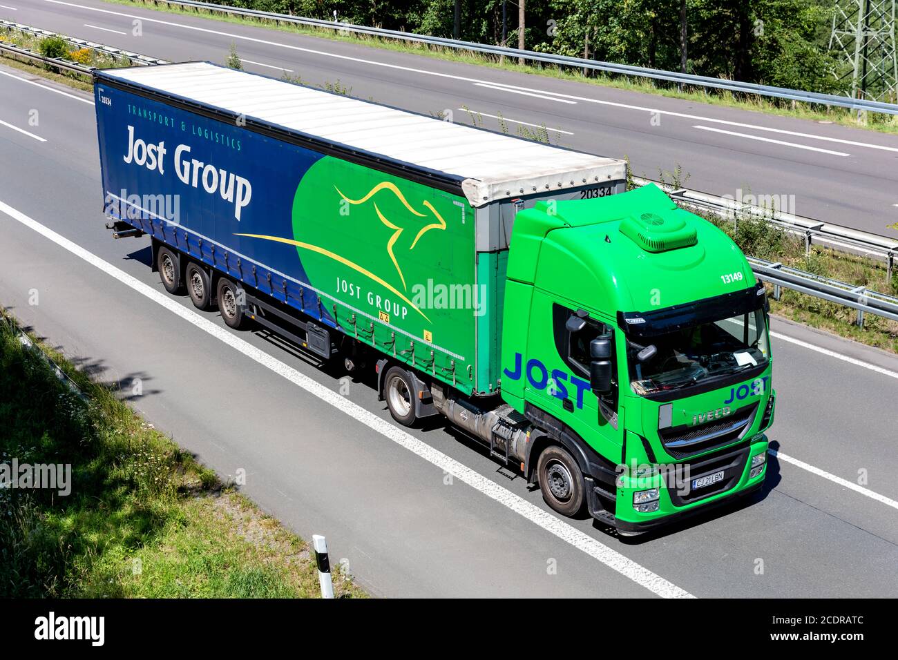 Jost Iveco Stralis truck with curtainside trailer on motorway Stock ...