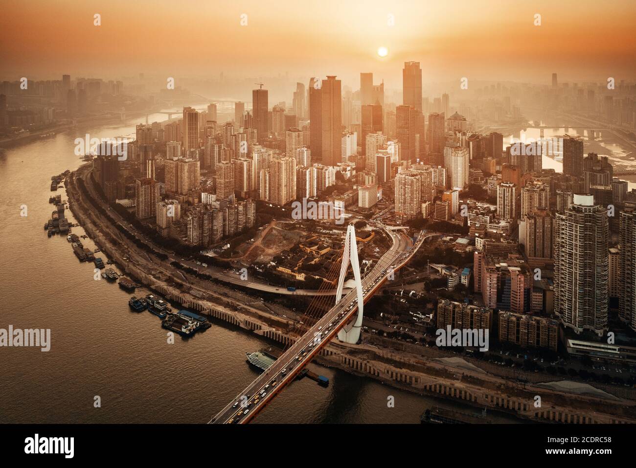 Aerial view of urban buildings and city skyline in Chongqing at sunset ...