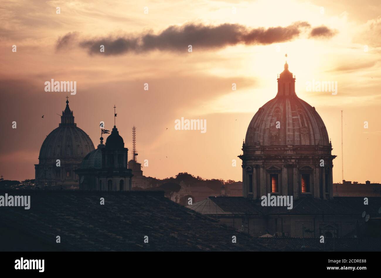 Sunset rooftop view with domes in Rome, Italy Stock Photo - Alamy