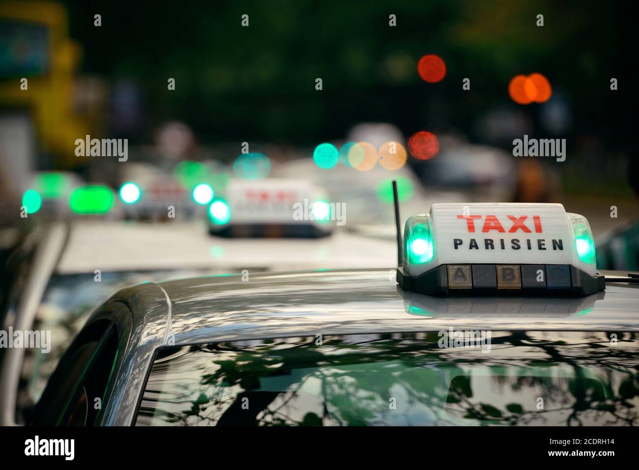 Taxi lined up in street in Paris Stock Photo - Alamy
