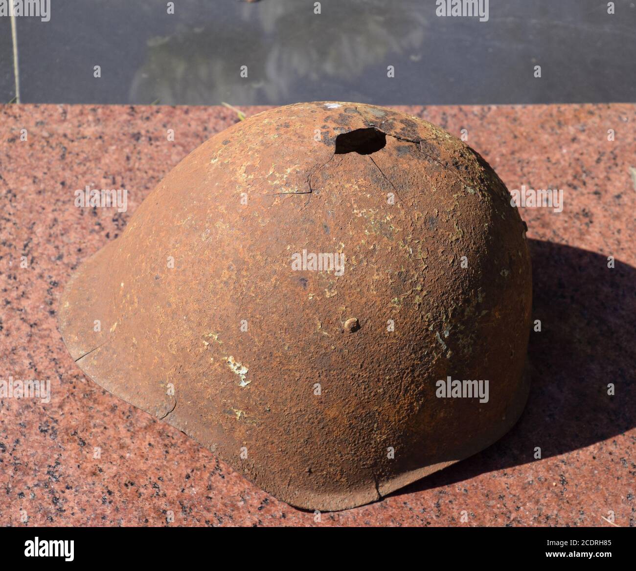 The old soldier's protective helmet. The helmet with a hole. The steel ...