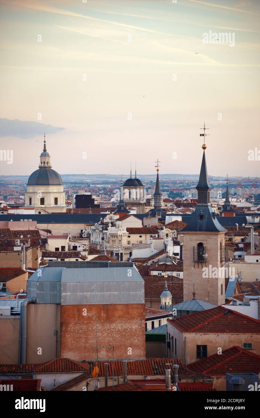 Madrid skyline rooftop view with buildings and church bell tower in ...