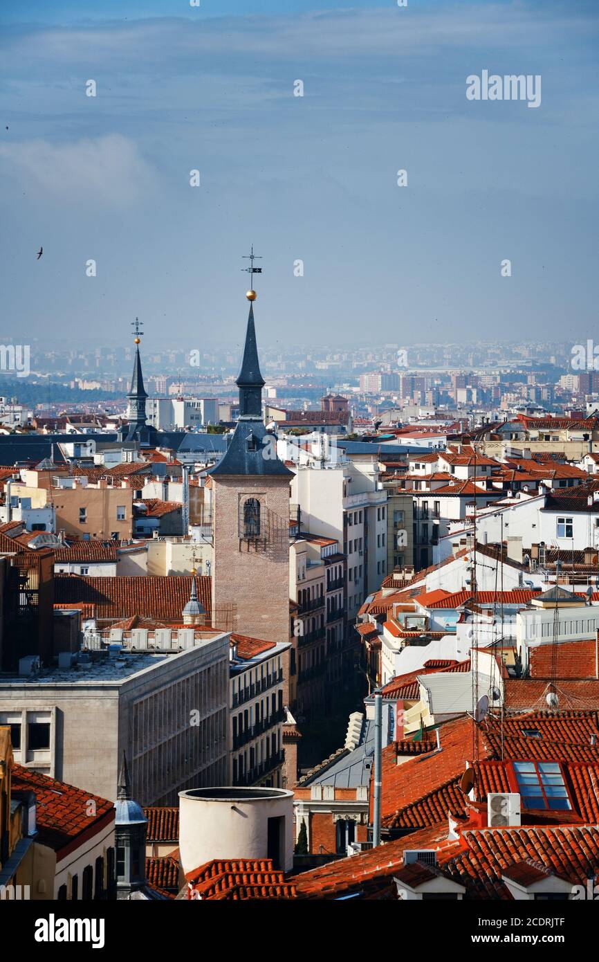 Madrid skyline rooftop view with buildings and church bell tower in ...
