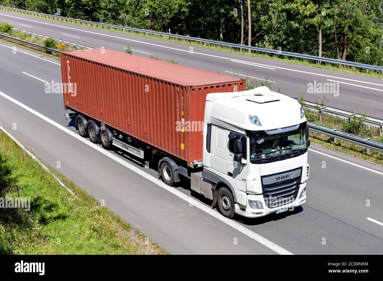 DAF XF truck with Triton container on motorway Stock Photo - Alamy